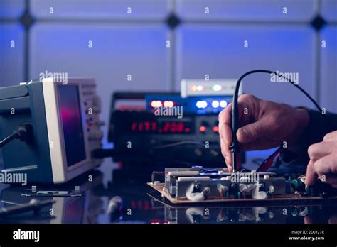 Debugging Electronics Device Pcb Witch Microcontroller In Electronics Laboratory Stock Photo