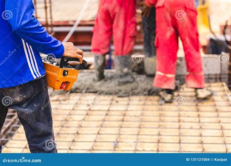 Worker Control Robot Arm To Loading And Unloading Workpiece Editorial Photo