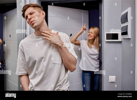Portrait Of Young Caucasian Woman Chastising Husband For His Antics
