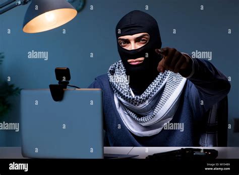 Hacker Wearing Balaclava Mask Hacking Computer Stock Photo Alamy