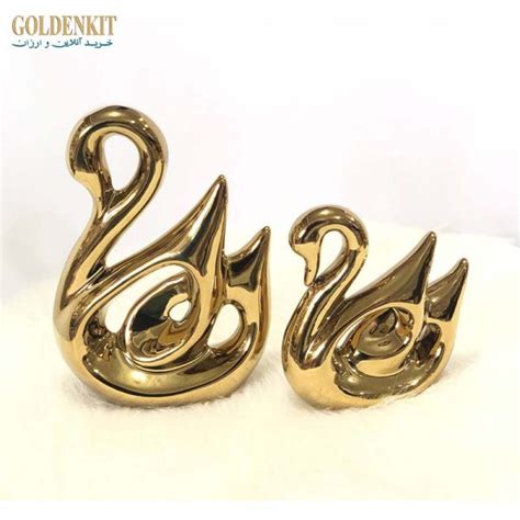 دکوری مجسمه قو جفتی طلایی و نقره ای فروشگاه گلدن کیت
