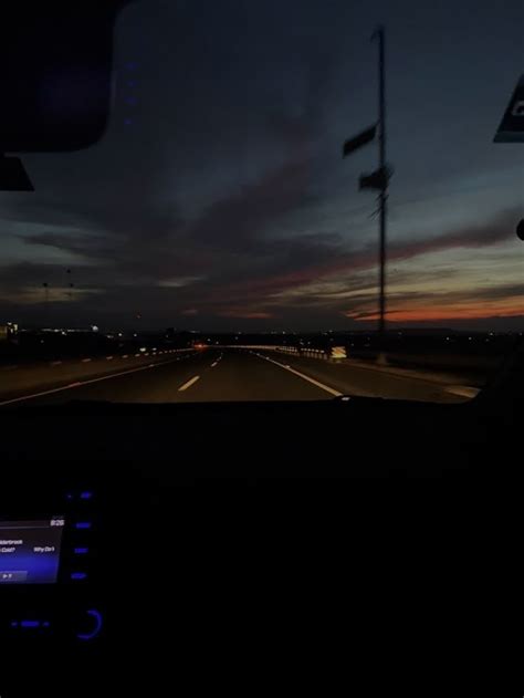 Dashboard Of A Car At Night With Lights On Plantas Interior