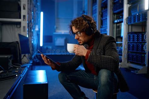 It Technician Using Digital Tablet While Working With Essential