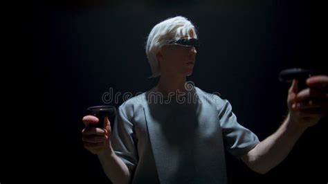 Teenager Playing Augmented Reality Game In Dark Room Focused Blonde