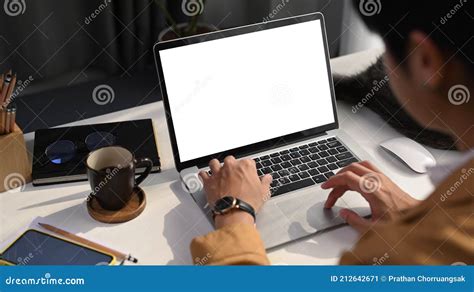 Young Man Freelancer Using Laptop Computer Searching Information At Comfortable Workplace Stock