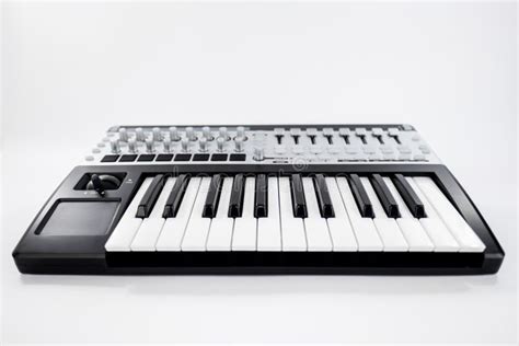 Modern Midi Keyboard Controller With Slipnet And Adjustment Knobs On White Background Stock