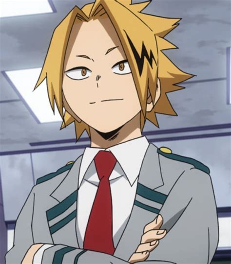 An Anime Character With Blonde Hair Wearing A Red Tie And Grey Suit Looking At The Camera