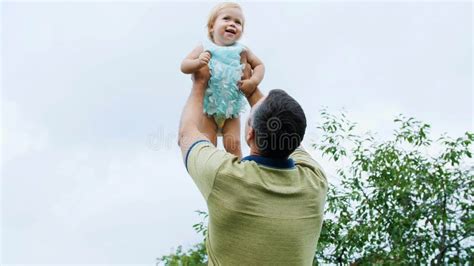 Summer In The Garden Mother A View From Below The Daddy Throws His One Year Old Daughter