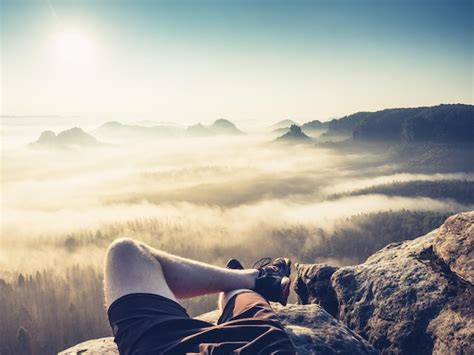 Premium Photo Resting Man Travelers Naked Legs Pointed Towards To Mountain Peaks At Distance