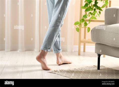 Woman Stepping Barefoot In Room At Home Closeup Floor Heating Stock