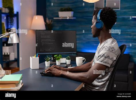 programmer businessman with headset typing binary code for website security working remote frrom