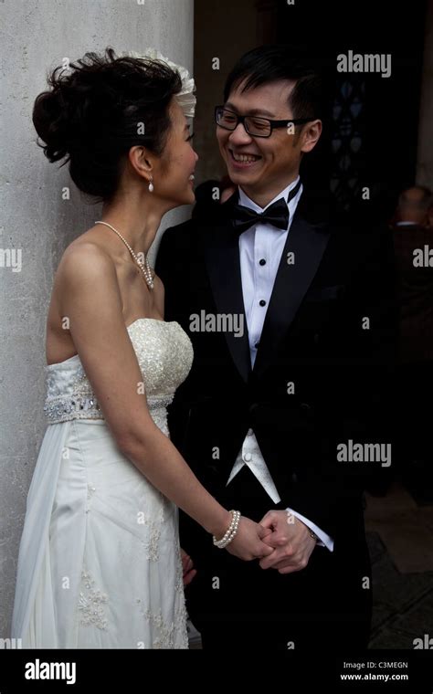 Bride And Groom From Hong Kong In St Marks Square During Venice