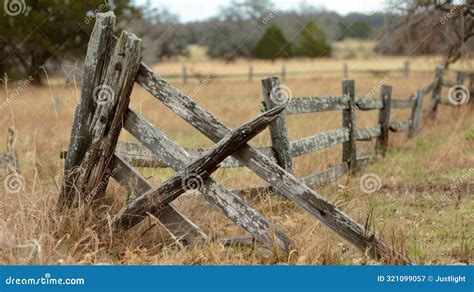 A Fence Leaning At An Angle A Result Of The Ground Beneath It Rising