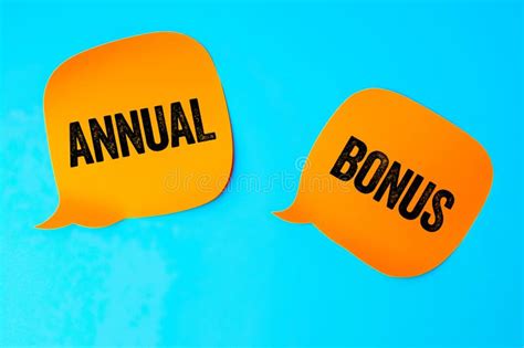 Annual Bonus Message Written On Orange Paper Speech Bubbles On Blue