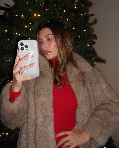 Hailey Bieber Posed In A Sexy Red Mini Sweater Dress On The Rhode