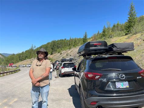 Motorists Retrieve Vehicles Stranded By Landslide On Highway To Mount