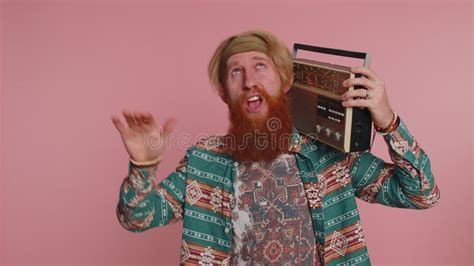 Hippie Redhead Man Using Retro Vintage Tape Record Player To Listen