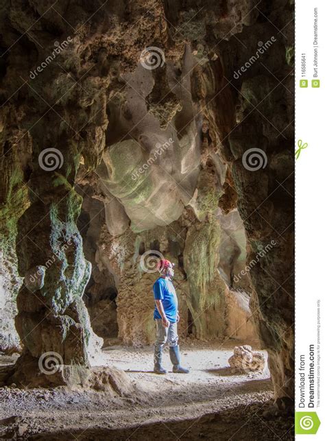 Man Stands In Santo TomÃ¡s Cave Visible From Shaft Of Light Fro Editorial Photo Image Of