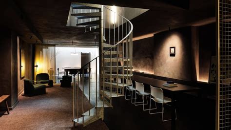 Cake Architecture Creates Office Space Spread Across Two Contrasting Floors