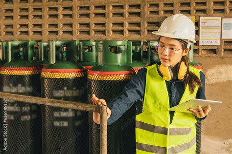 Asian Female Safety Officer Inspects The Engineering Department Of