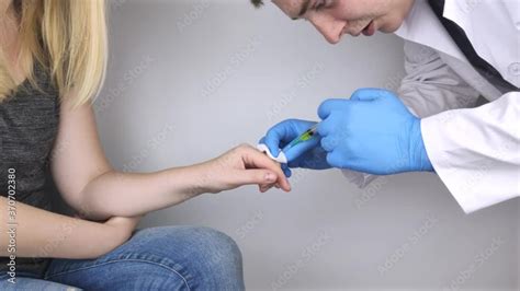 An Orthopedic Surgeon Gives An Injection In The Finger Joint Treatment Of Osteoarthritis With