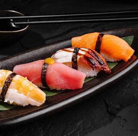 Premium Photo Assorted Nigiri Sushi On Elegant Dark Plate