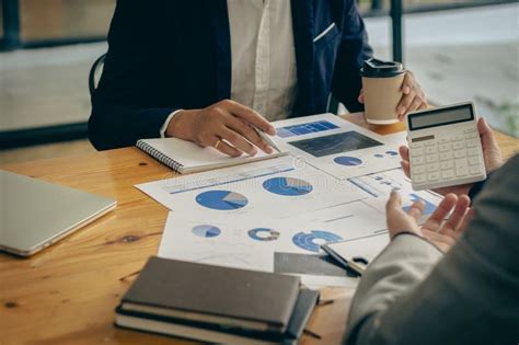 Business Team Analyzing Data Using Computer While Spending Time In