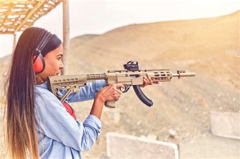 Premium Photo Girls With A Machine Gun Practice Target Shooting