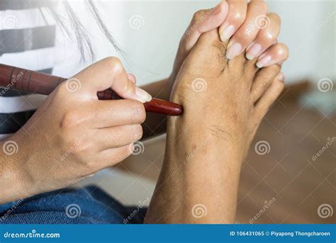 Thai Foot Massageoppresses Energy Flow Point With Stick Stock Image