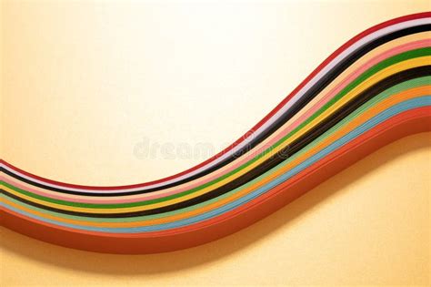 Beautiful Curve Of Strip Cut Of Multi Colored Paper On Golden Textured Beautiful Curve Of Strip Cut Of Multi Colored Paper On Golden Textured