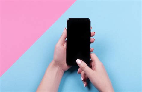 Premium Photo Top View Of A Woman Hand Using Iphone On Yellow Background