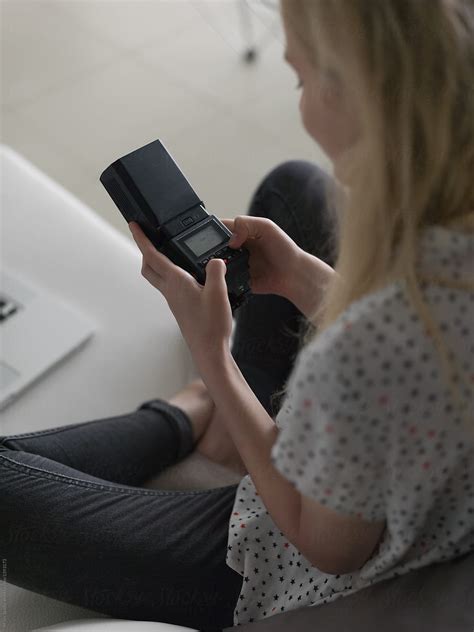 Woman Setting Flash By Stocksy Contributor Milles Team Stocksy