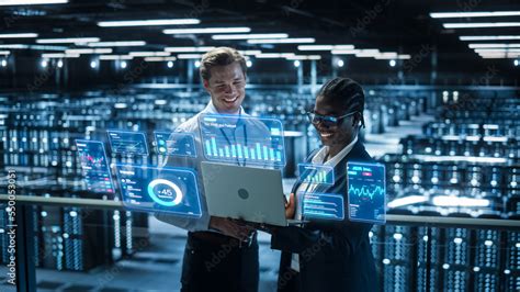 Technical Engineer And Project Administrator Using Computer In Modern Data Center Server Room