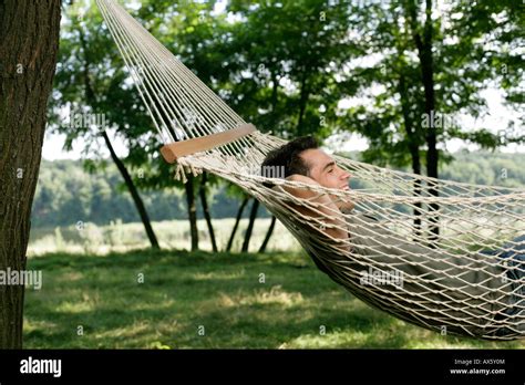 Man Lying In Hammock Stock Photo Alamy