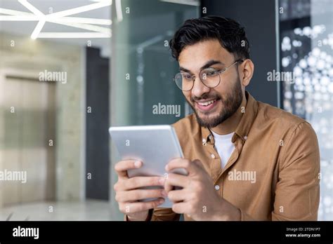 Young Hindu Programmer Close Up Inside Office Using Application On Young Hindu Programmer Close Up Inside Office Using Application On