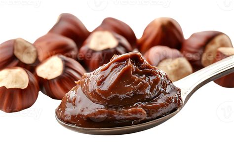 Hazelnut Spread In Spoon With Hazelnuts In Background Delicious And Creamy Hazelnut Spread With