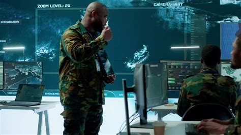 Military Officer Leads Cybersecurity Efforts In A High Tech Control Center Ensuring Data