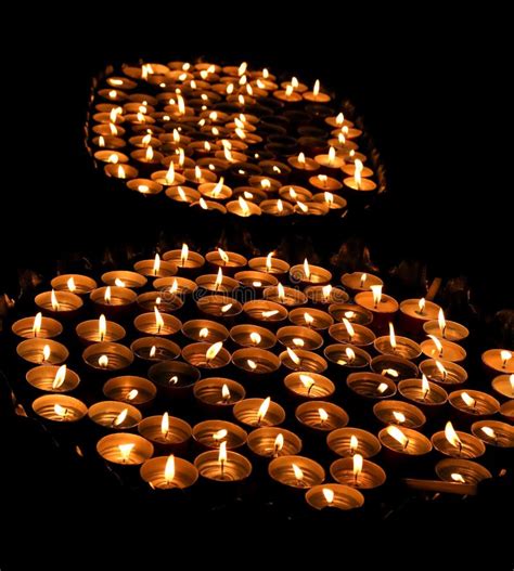 Candles Lit With The Warm Flame During The Religious Ceremony Stock