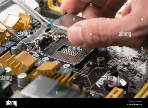 Technician Plug In CPU Microprocessor To Motherboard Socket Stock Photo Alamy