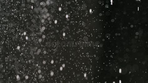 Many Bright Dust Particles Of White Powder In Low Light On Empty Dark