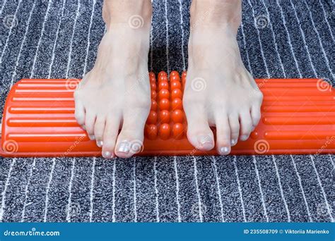 Massage Of Wooman Feet With An Acupuncture Massager Acupressure Stock Image Image Of
