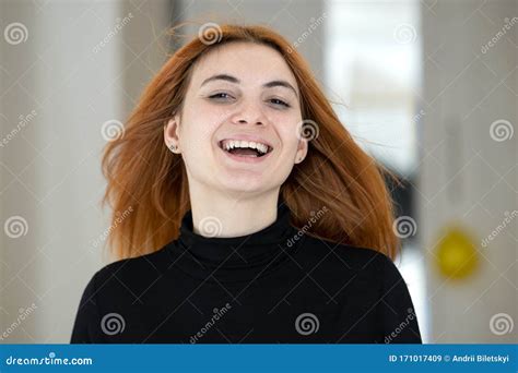 Close Up Portrait Of Pretty Redhead Girl With Long Wavy Hair Blowing On