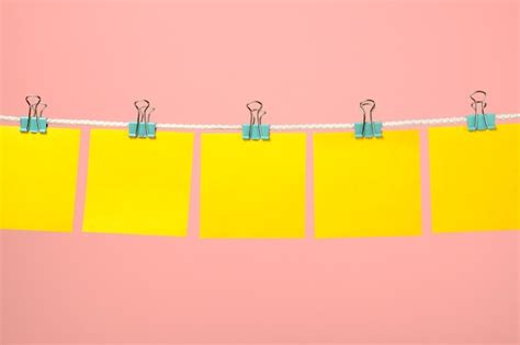 Premium Photo Blank Yellow Paper Notes On The String