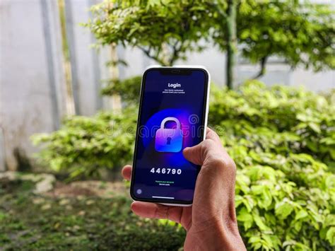 Man Holds Smartphone With Two Factor Authentication Login Screen Stock