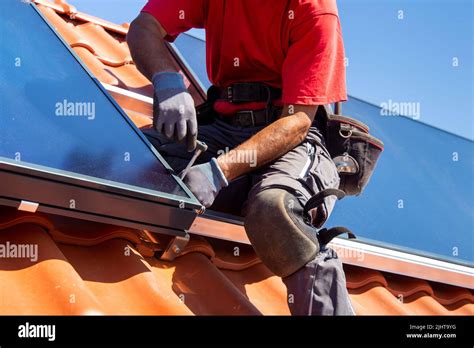 Installation Of A Solar System Craftsmen Attach The Solar Panels Stock Photo Alamy