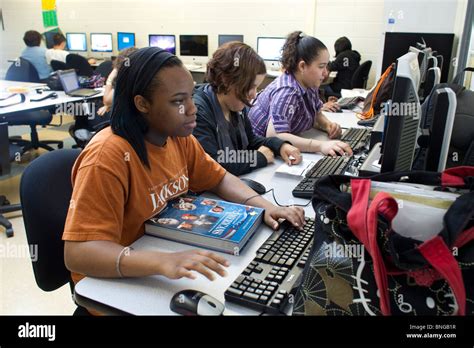 High School Students Work On Computers In American History Class At