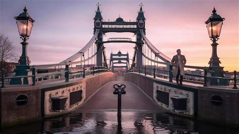 Premium Photo Man On The Bridge In Amsterdam Python Bridge