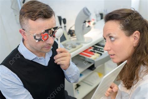Patient On Optometrist Eye Test With Eye Chart Photo Background And