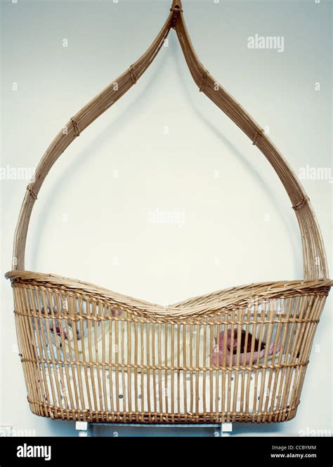 Baby Lying In Wicker Basket Stock Photo Alamy