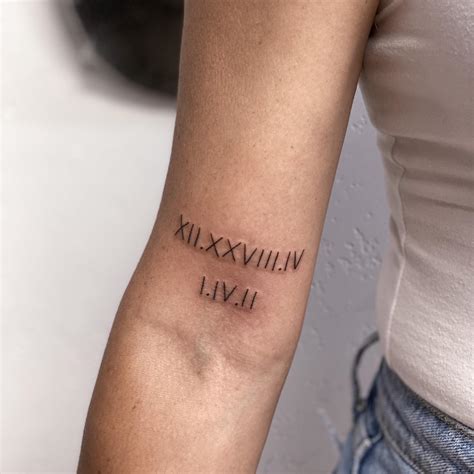 Roman Numerals Tattoo Forearm